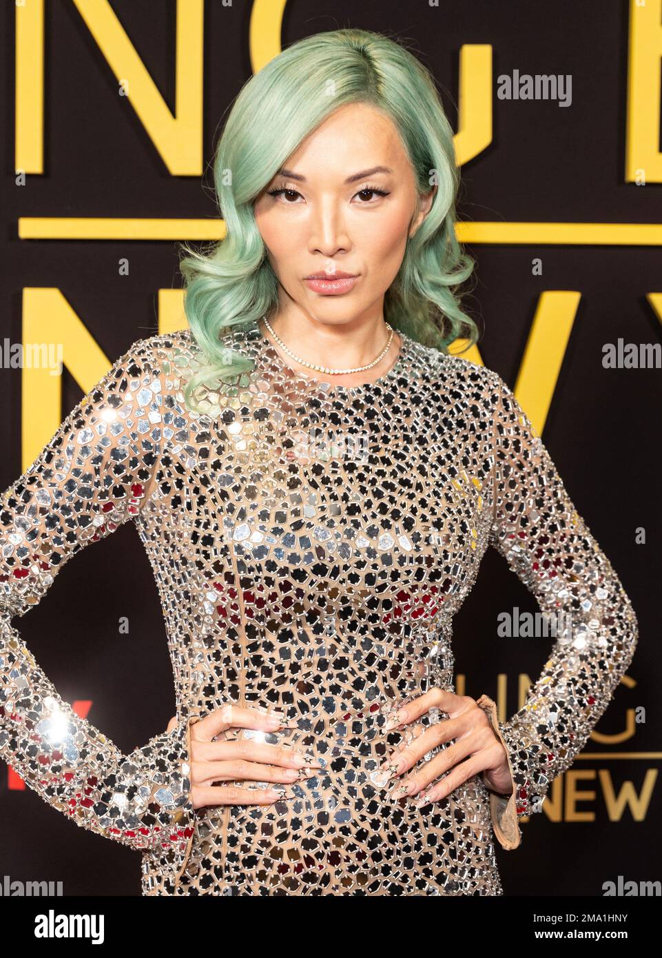 Tina Leung wearing dress and overcoat by Michael Kors attends launch of Bling Empire New York by ...