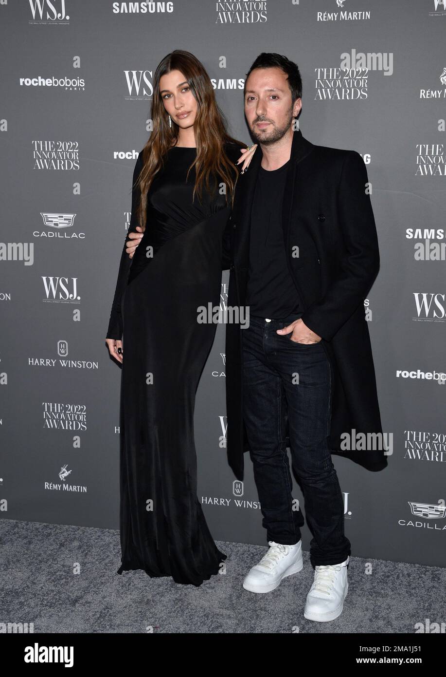 Hailey Bieber, left, and designer Anthony Vaccarello attend the WSJ ...