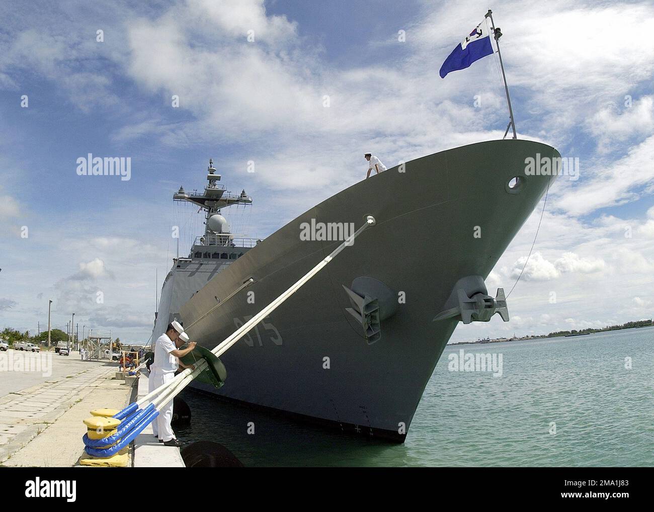 Republic of Korea Navy (ROKN) Sailors place a "rat guard" on the bow ...