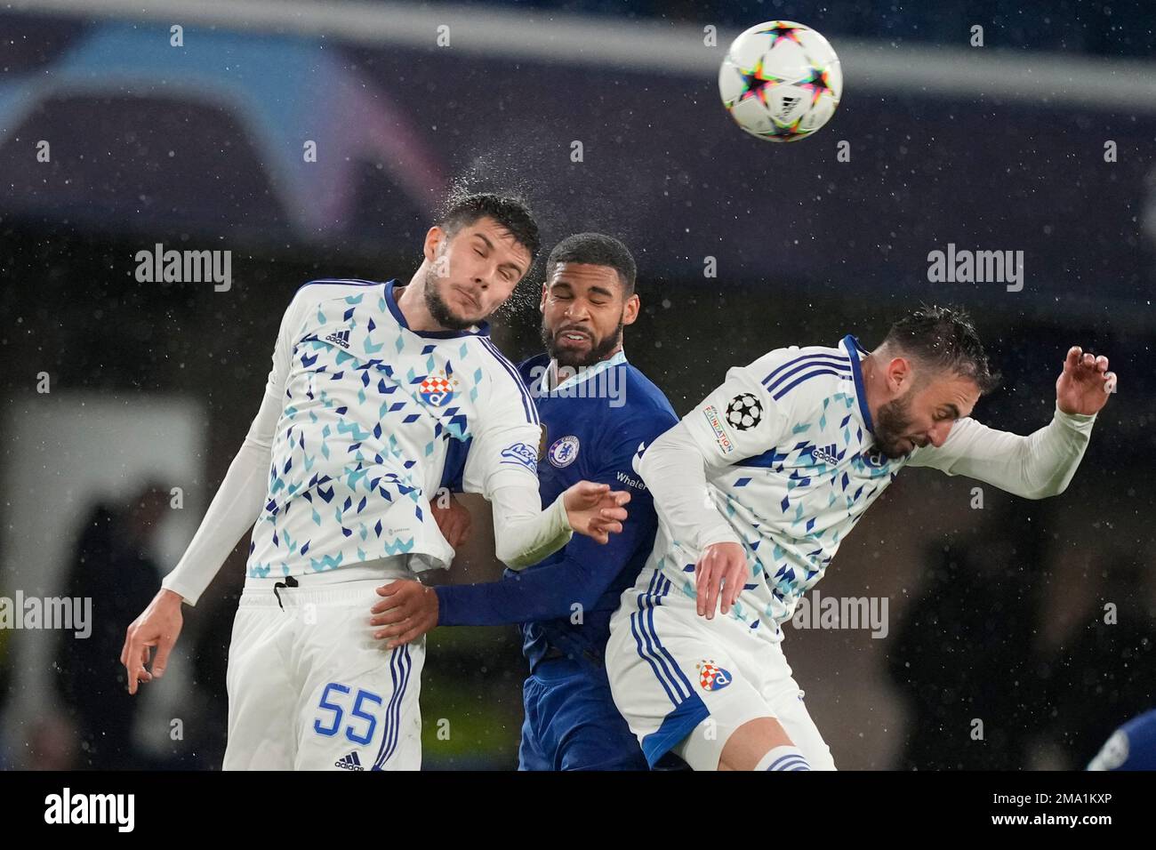 Dinamo's Dino Peric, left heads the ball under pressure from Chelsea's ...