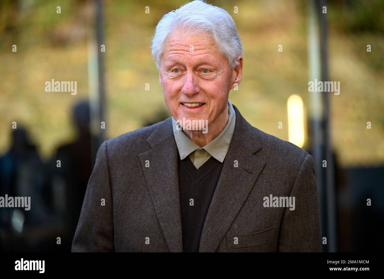 Former President Bill Clinton talks while touring exhibits in the ...