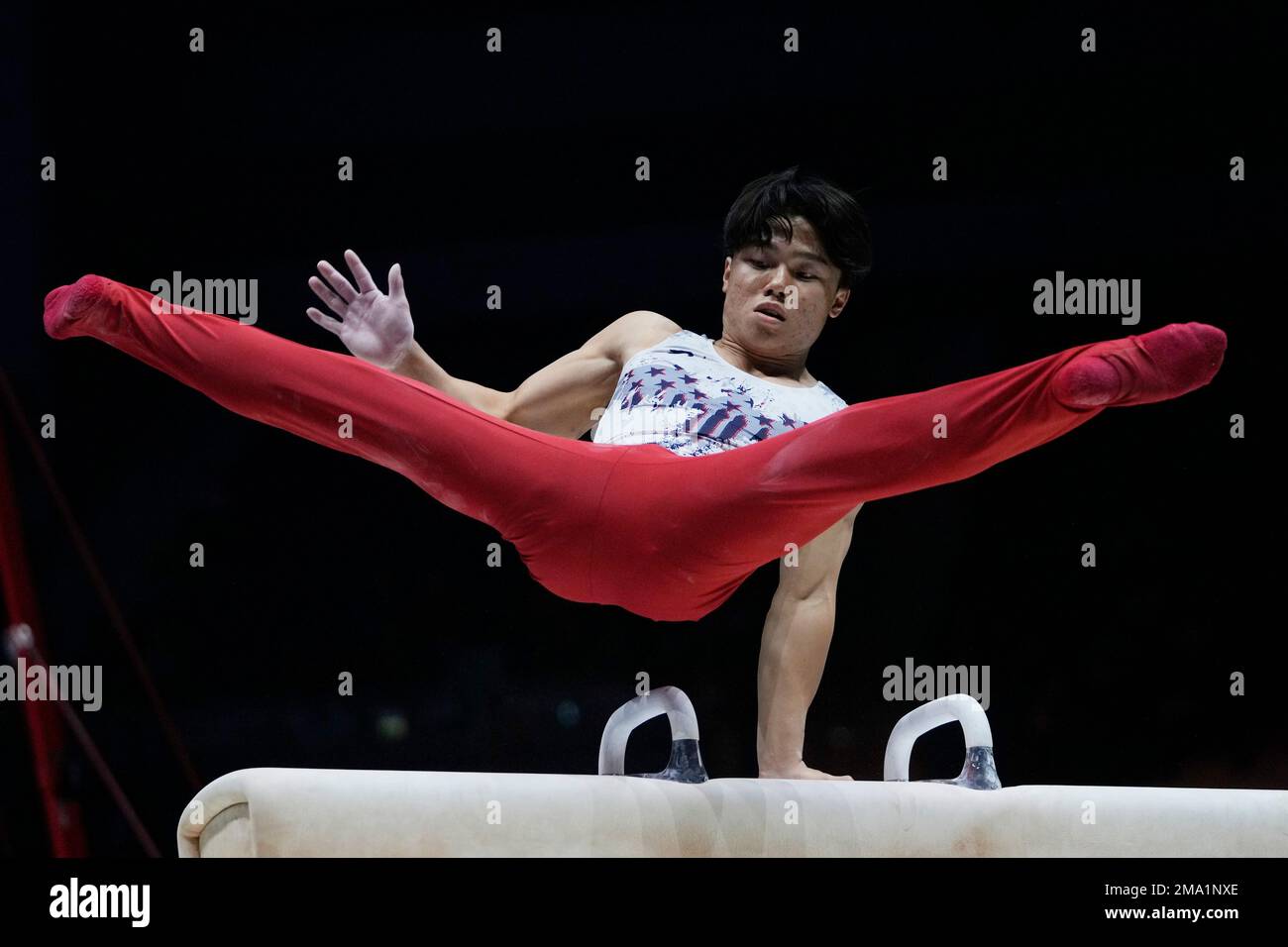 Asher Hong of the U.S. competes on the pommel horse at the Men's Team ...