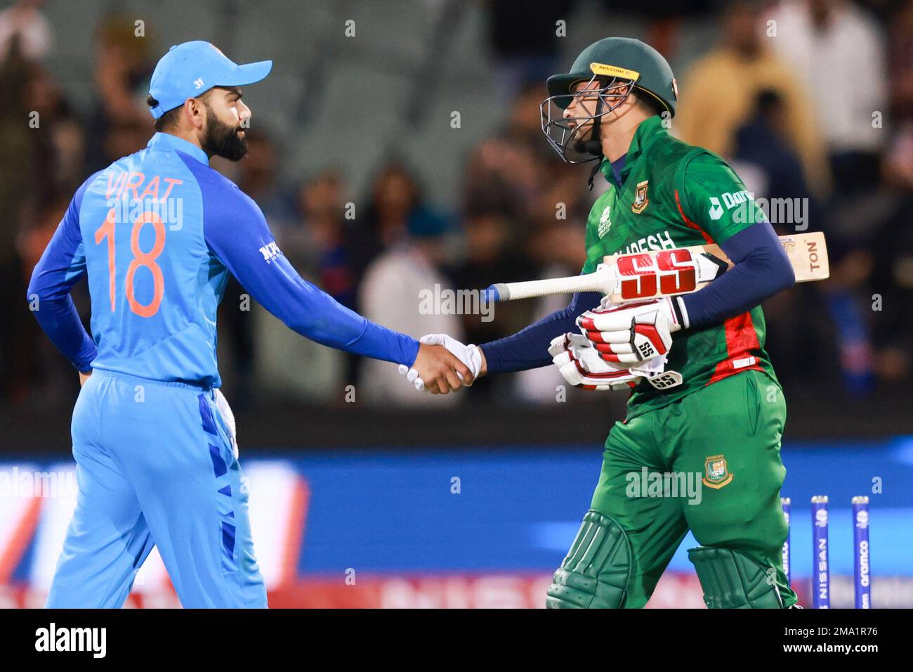 India's Virat Kohli, left, shakes hands with Bangladesh's Nurul Hasan ...