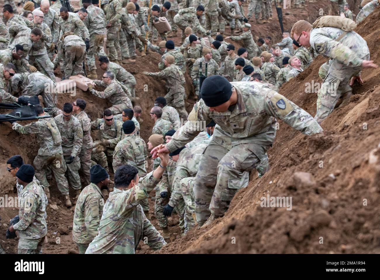 Soldiers assigned to 4th Infantry Division climb in and out of an anti ...