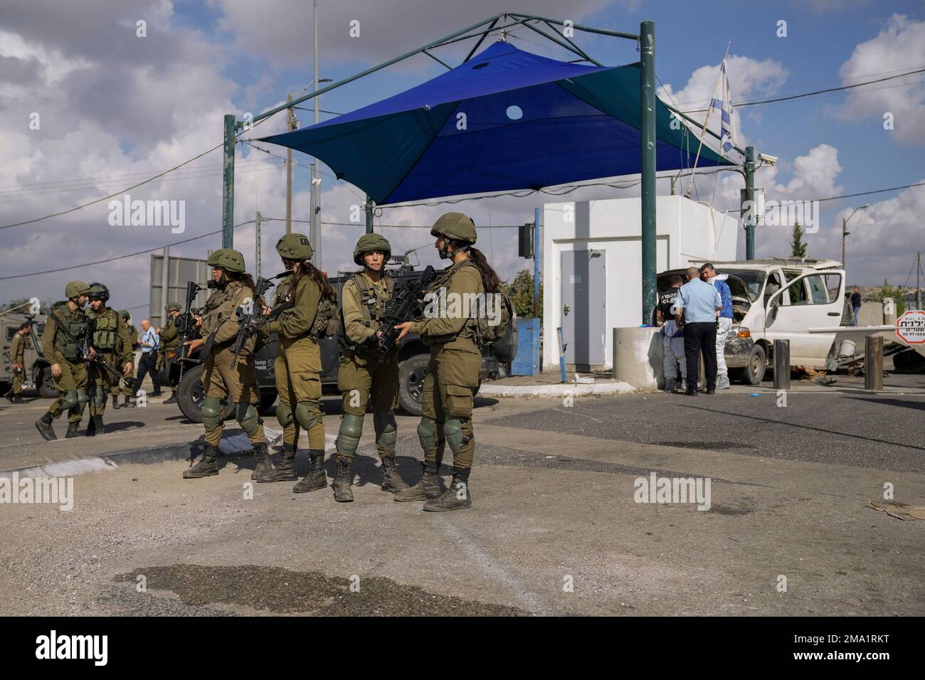 Israeli soldiers secure the site of car ramming attack at the Maccabim ...