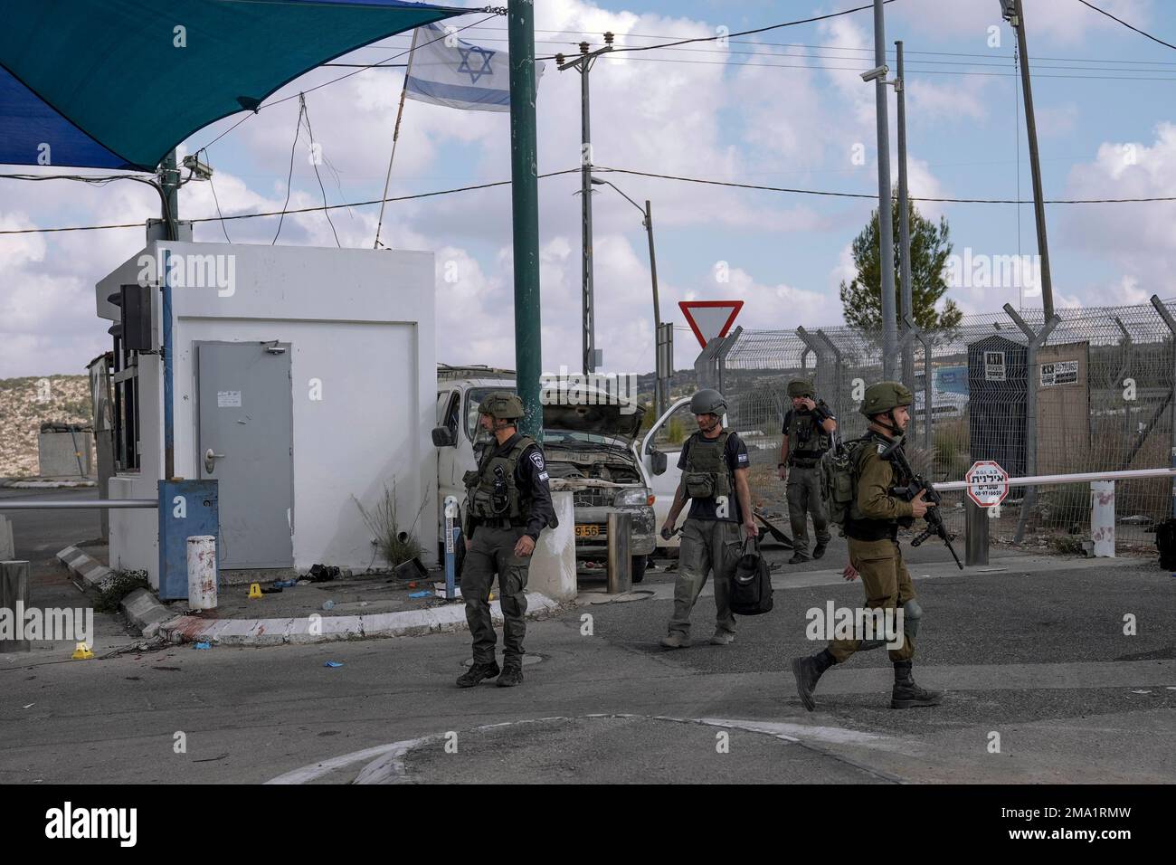 Israeli soldiers secure the site of car ramming attack at the Maccabim ...