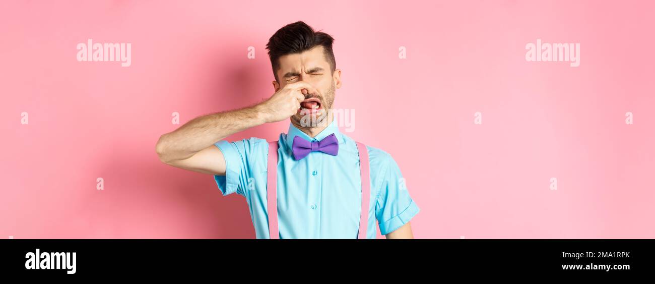 Image of man crying from disgusting smell, shut his nose from awful ...