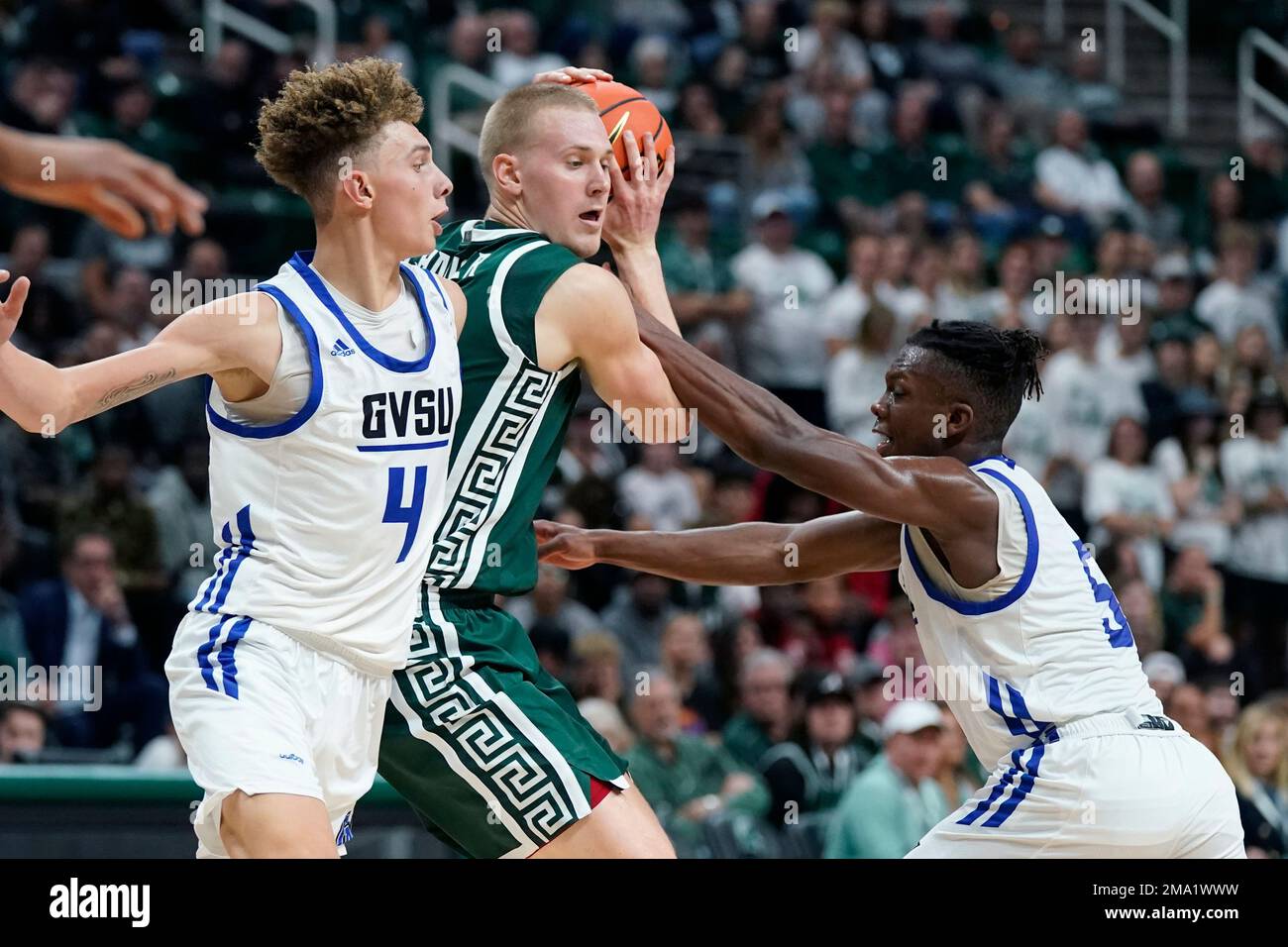 Michigan State forward Joey Hauser is fouled by Grand Valley State ...