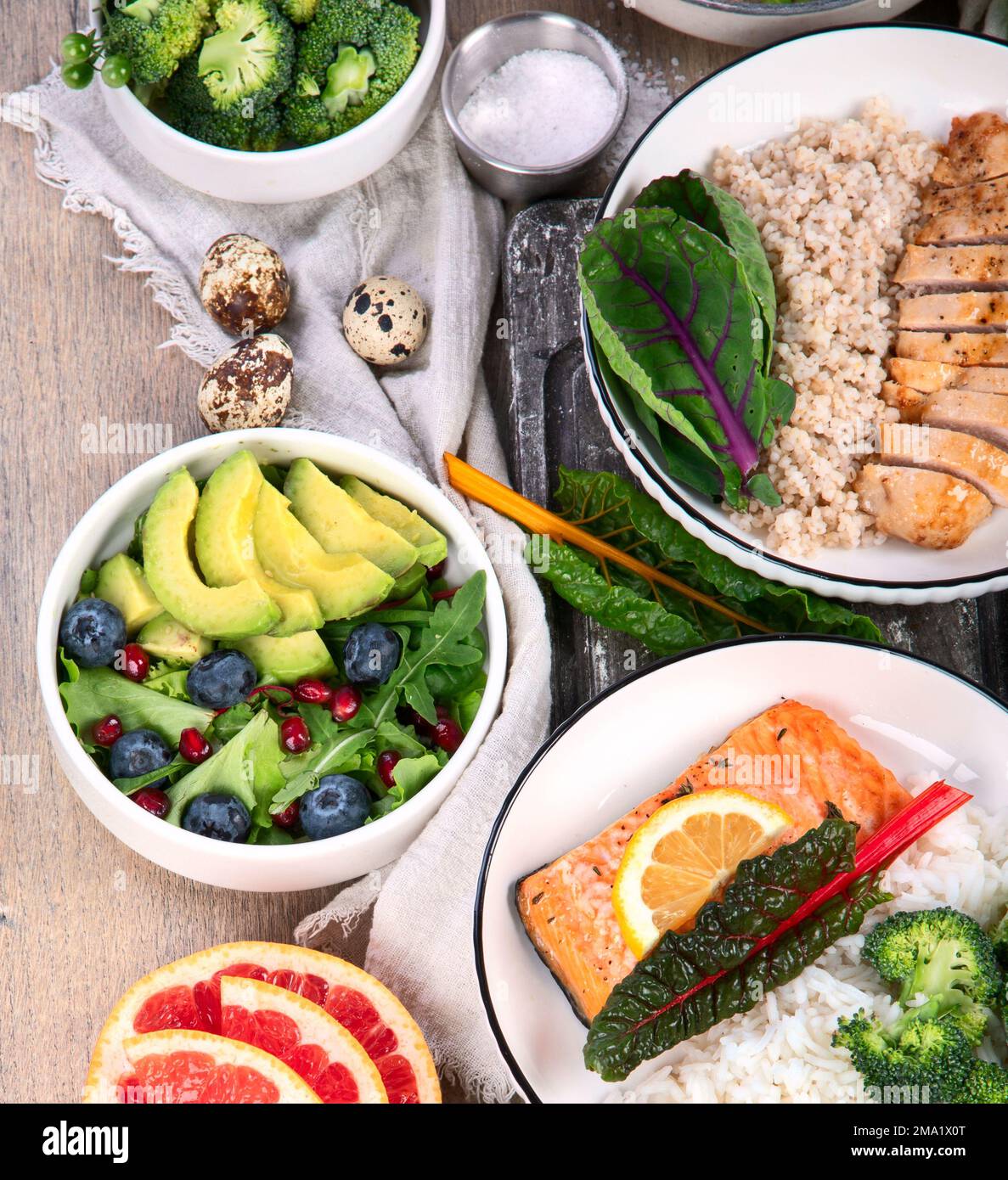 Table of various healthy food dishes. Healthy food assortment. Dieting ...