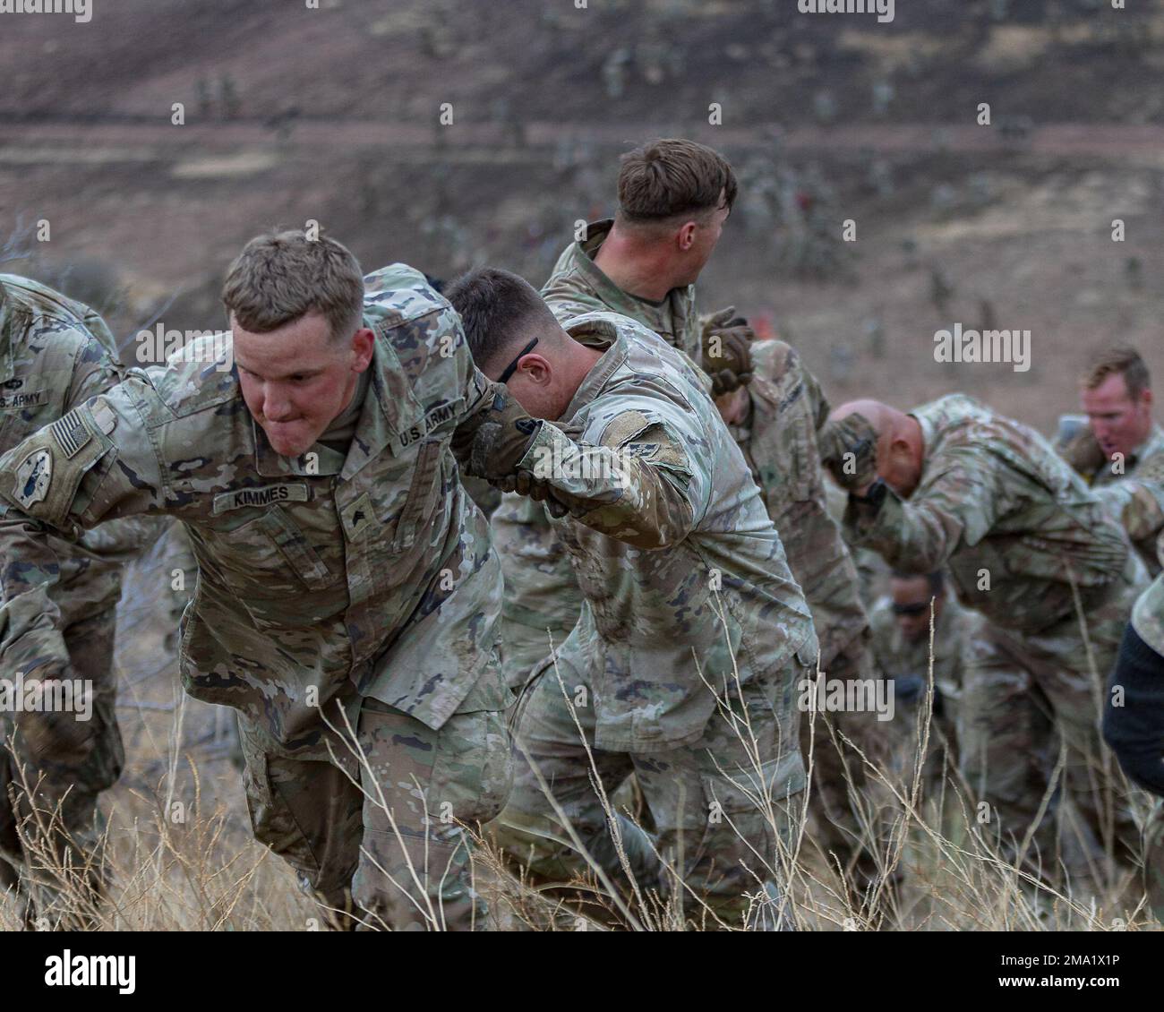 Soldiers assigned to 4th Infantry Division help each other, May 23 ...