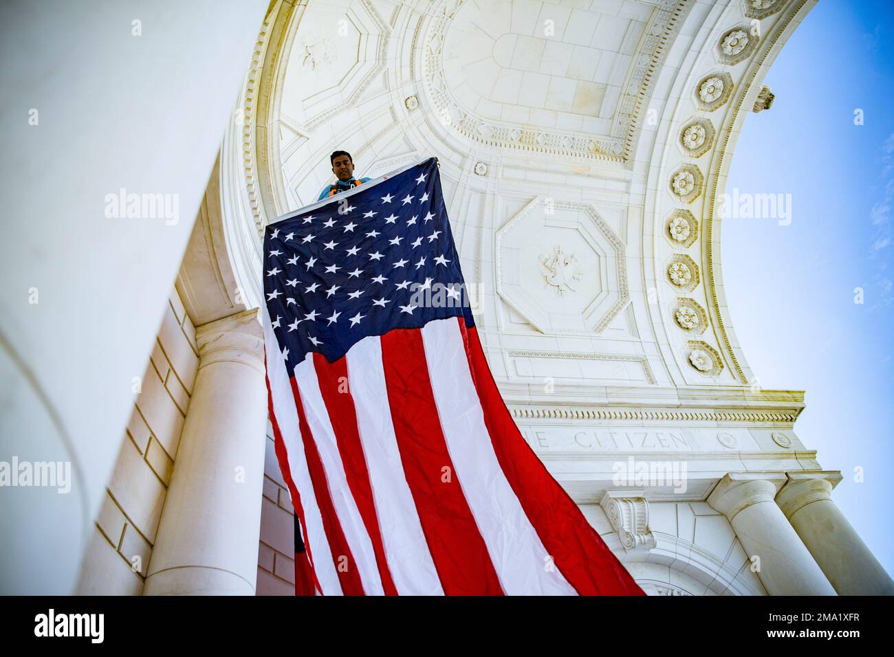 ANC Facilities Maintenance employees hang U.S. flags in the Memorial ...
