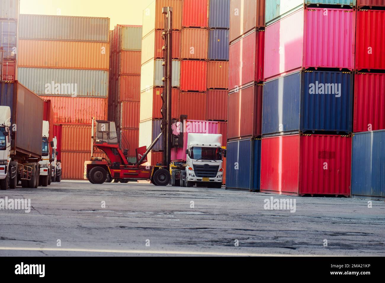 Container forklifts and trucks in the container yard Focus on imports ...