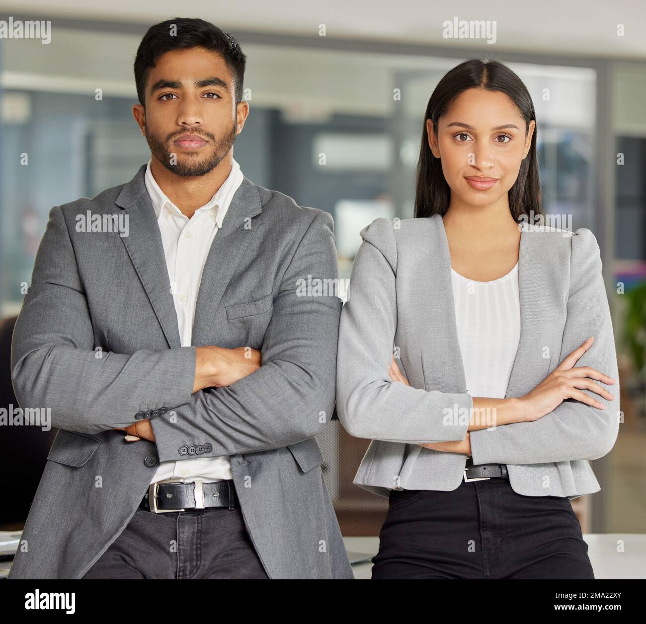 Team up and level up. Portrait of a young businessman and businesswoman ...