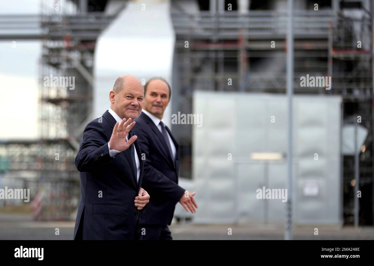 German Chancellor Olaf Scholz, left, is accompanied by the CEO of BASF ...
