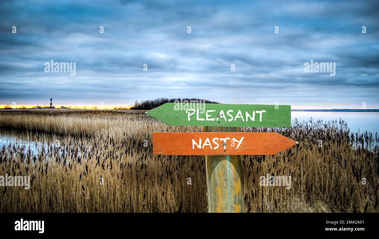 Street Sign the Direction Way to Pleasant versus Nasty Stock Photo - Alamy