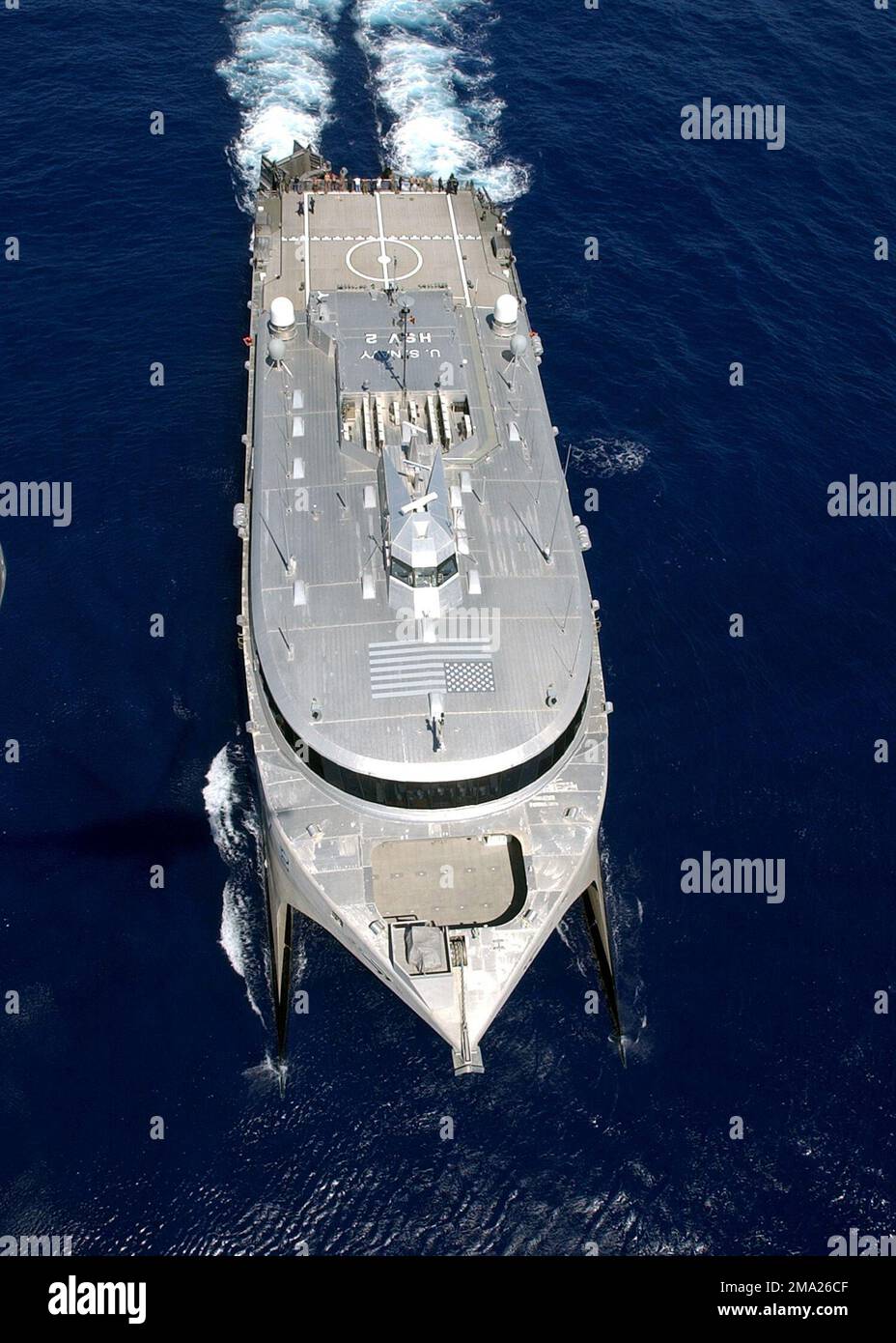 040710-N-6551H-097. [Complete] Scene Caption: Aerial oblique bow on ...