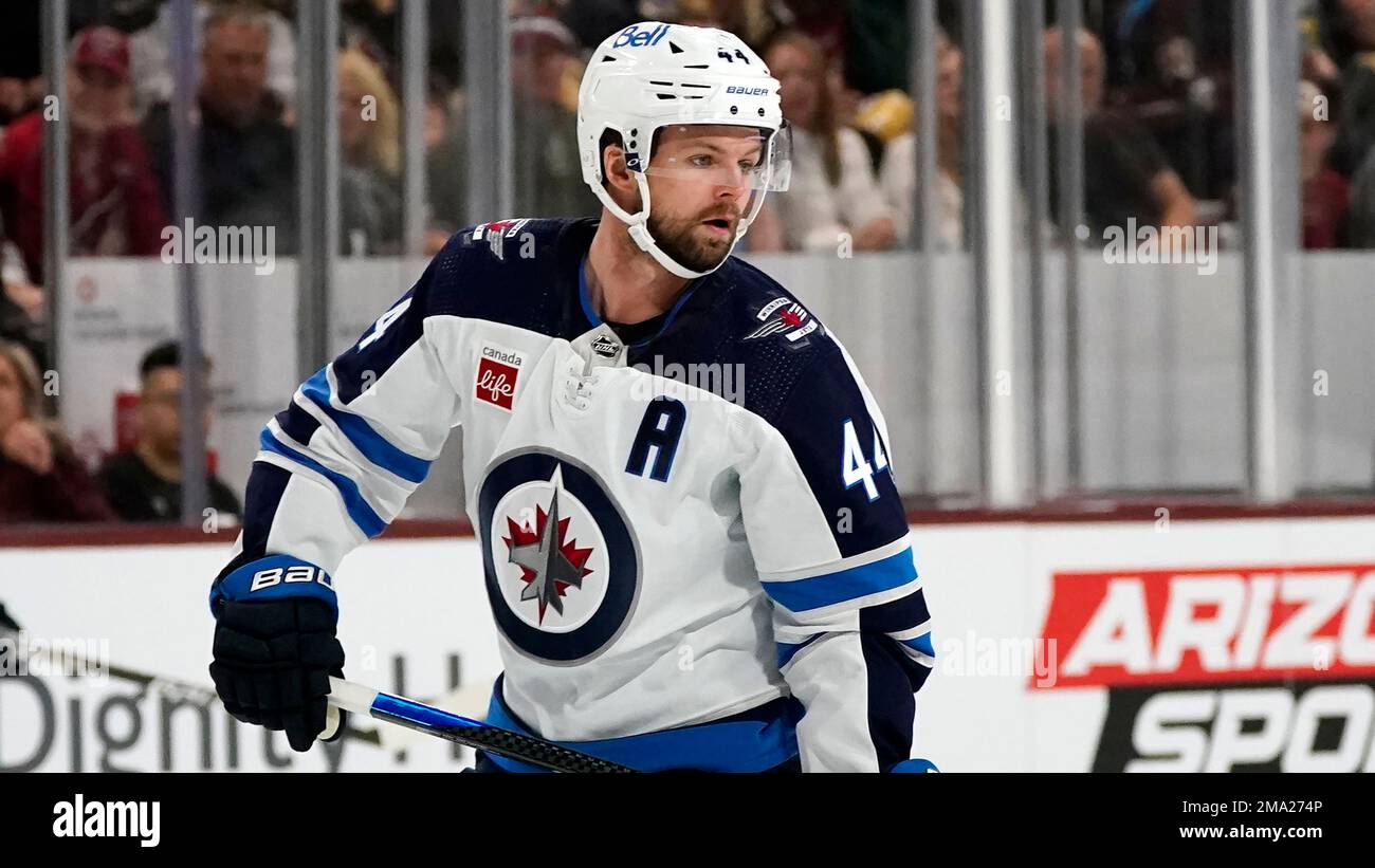 Winnipeg Jets defenseman Josh Morrissey watches the movement of the ...