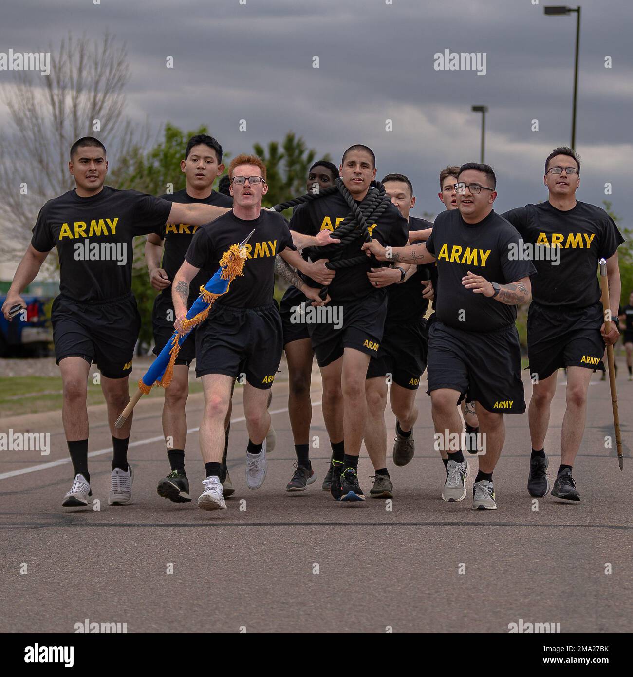Soldiers assigned to the 4th Infantry Division hurry to the finish line ...