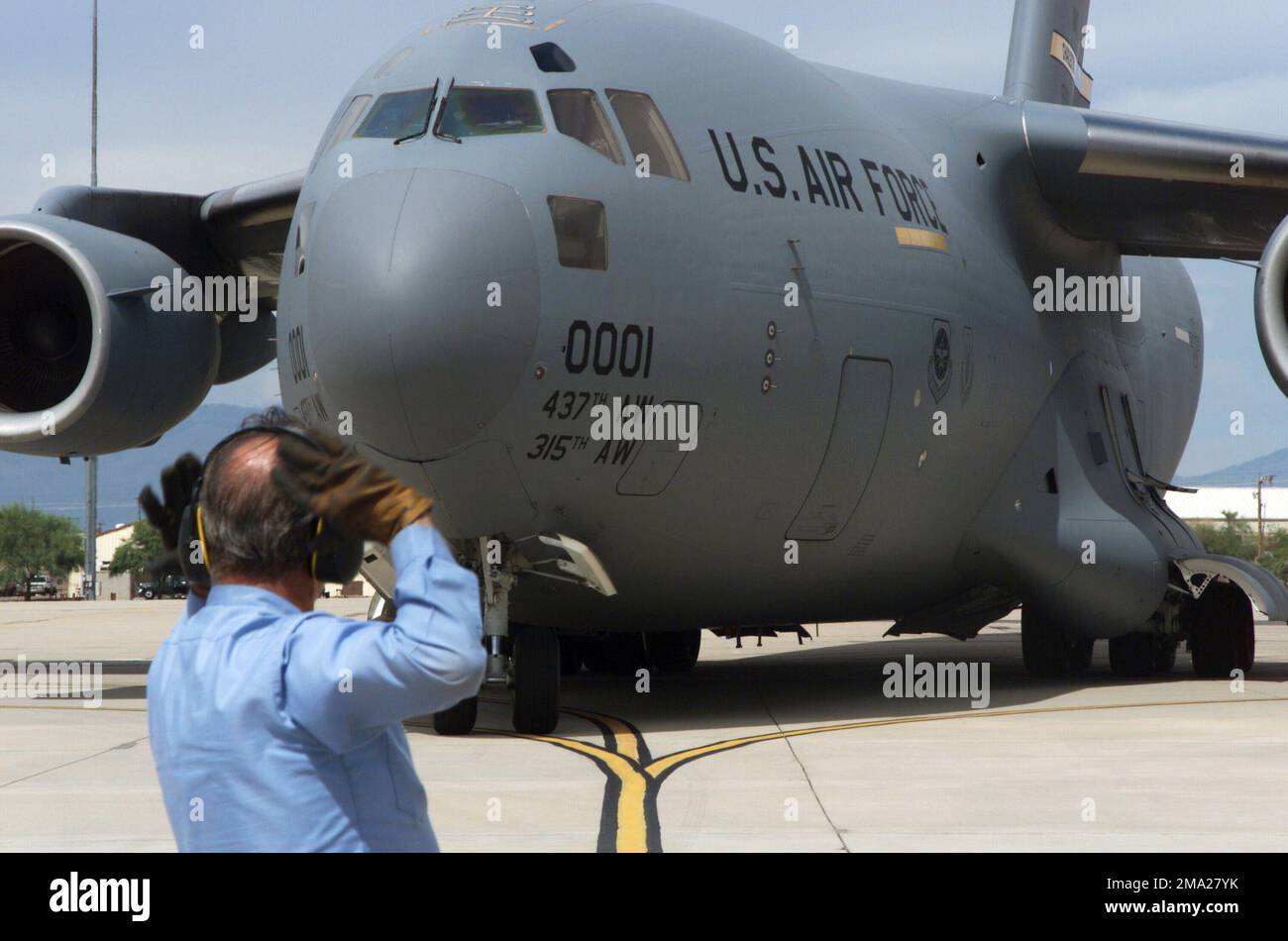 040813-F-3208M-264. A member of Transient Alert (TA) marshals in one of ...