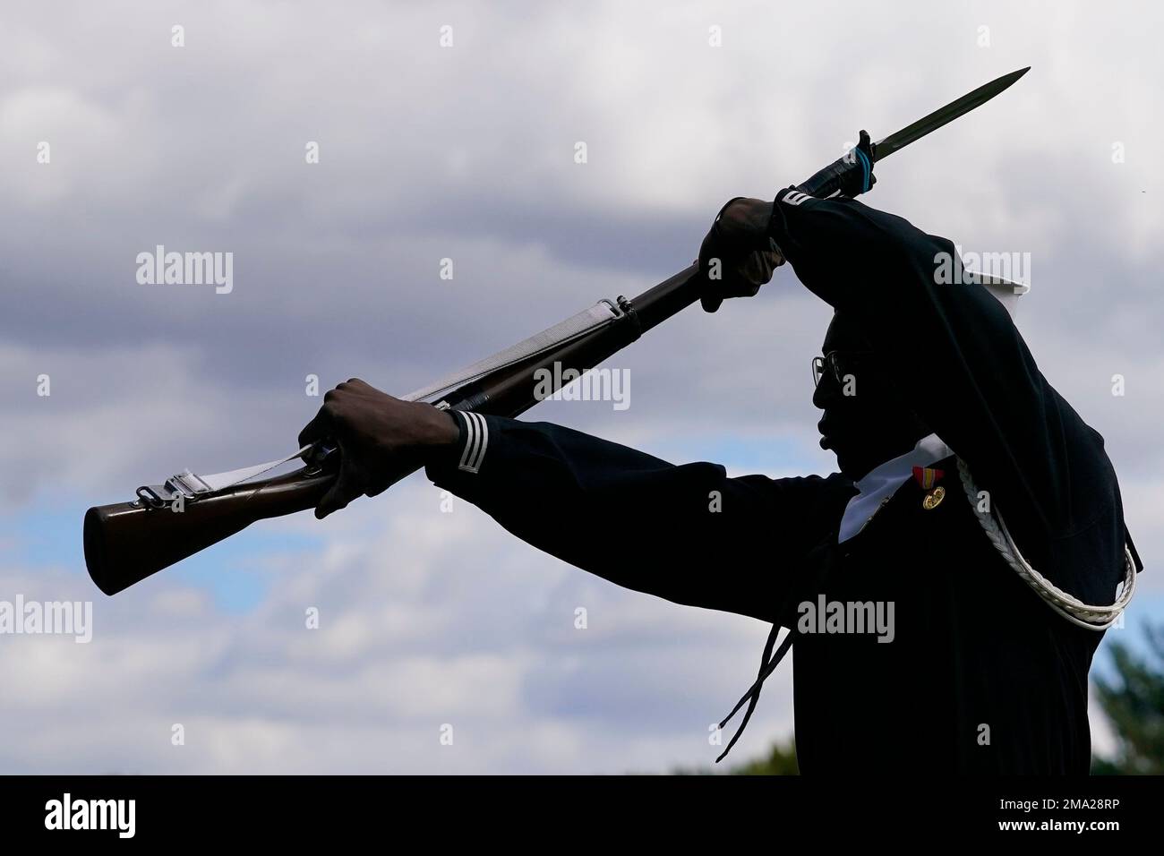A member of the U.S. Navy Drill Team practices before competing at the ...
