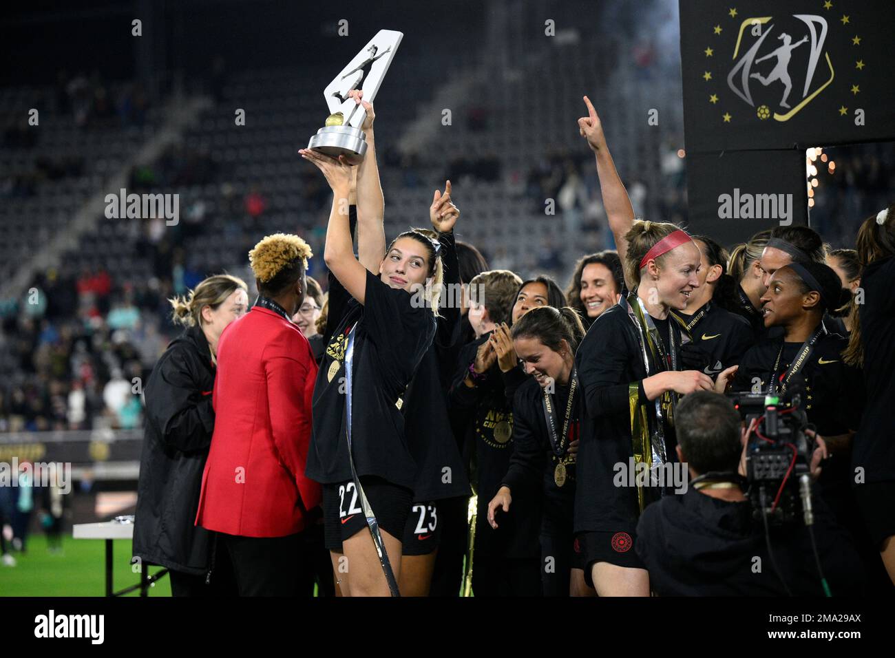 Portland Thorns FC forward Morgan Weaver (22) hoists the trophy after ...