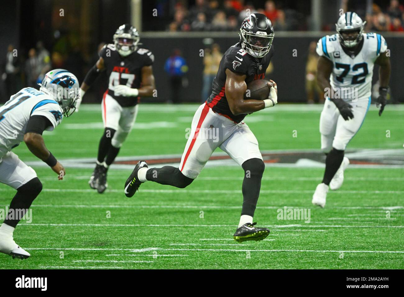 Atlanta Falcons linebacker Lorenzo Carter (9) runs with an interception ...
