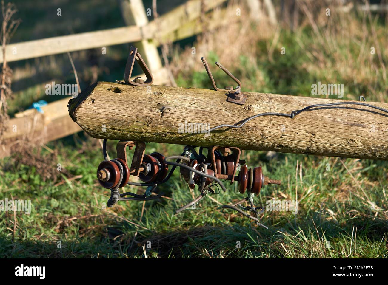 Old wooden fallen telegraph pole example Stock Photo - Alamy