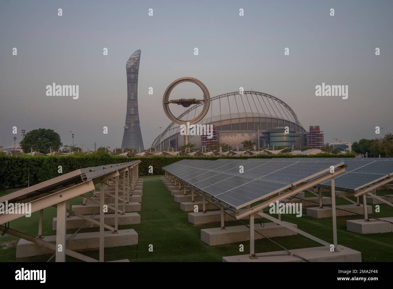 Solar panels stand on grounds in front of Khalifa International Stadium ...