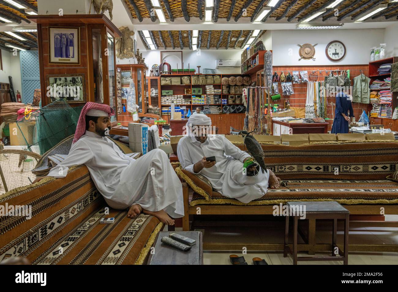 Salesmen sit in their falcon shop in Souq Waqif, Doha, Qatar, Sunday ...