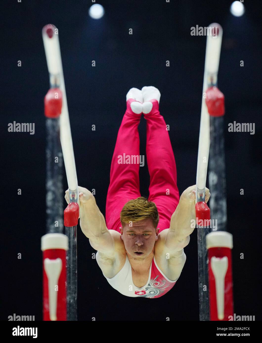 Moreno Kratter of Switzerland competes on the parallel bars during the ...