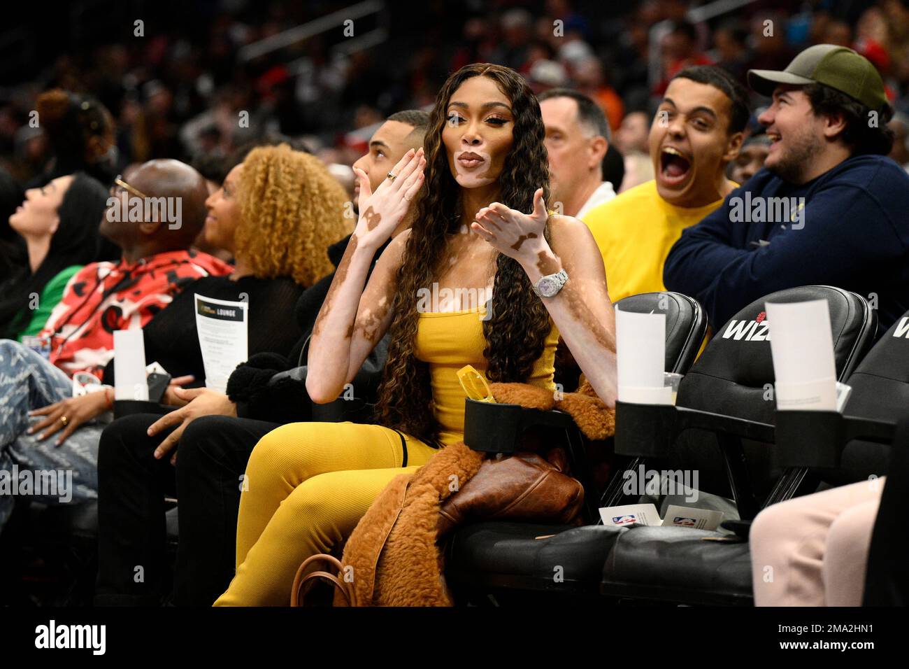 Fashion model Winnie Harlow reacts during the first half of an NBA ...