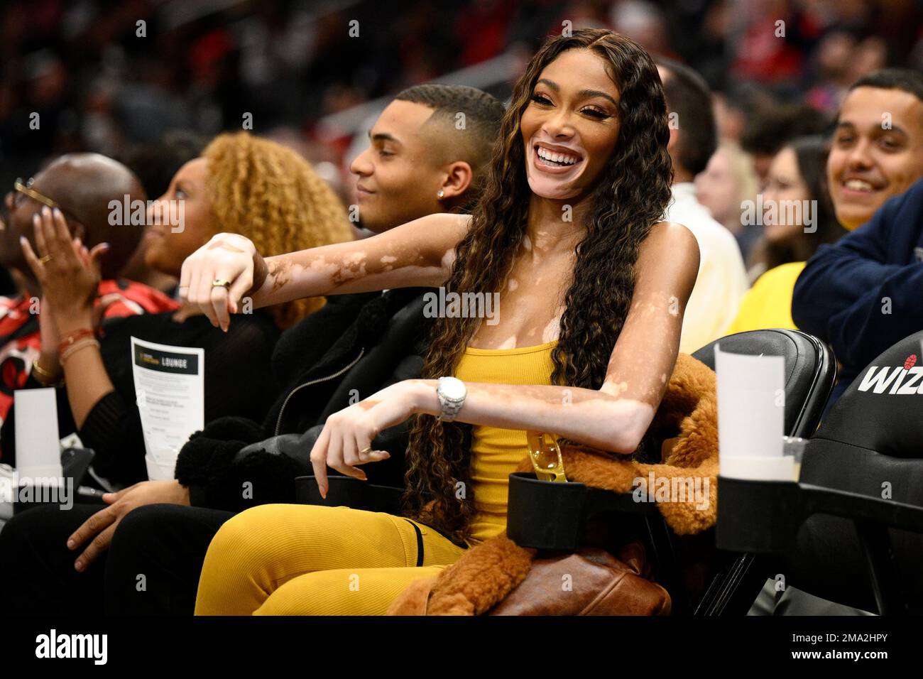 Fashion model Winnie Harlow reacts during the first half of an NBA ...