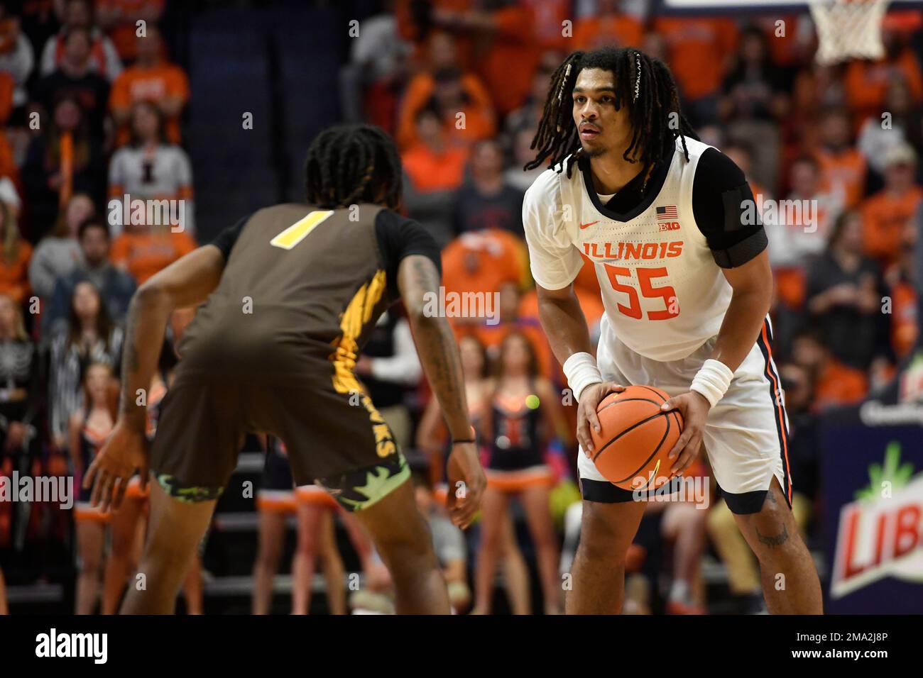 Illinois' Skyy Clark (55) looks for a passing outlet as Quincy's Isaiah ...