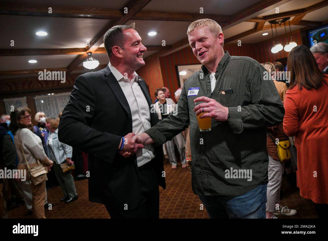 Democrat Francis Conole, left, greets Bryan Bowers at his campaign ...