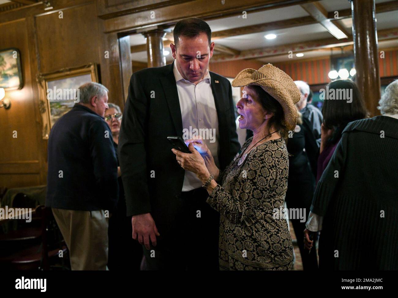 Democrat Francis Conole, center, chats with Barbara Updike at his ...