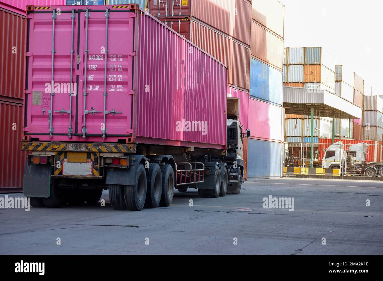 Trucks in the container yard Stock Photo - Alamy