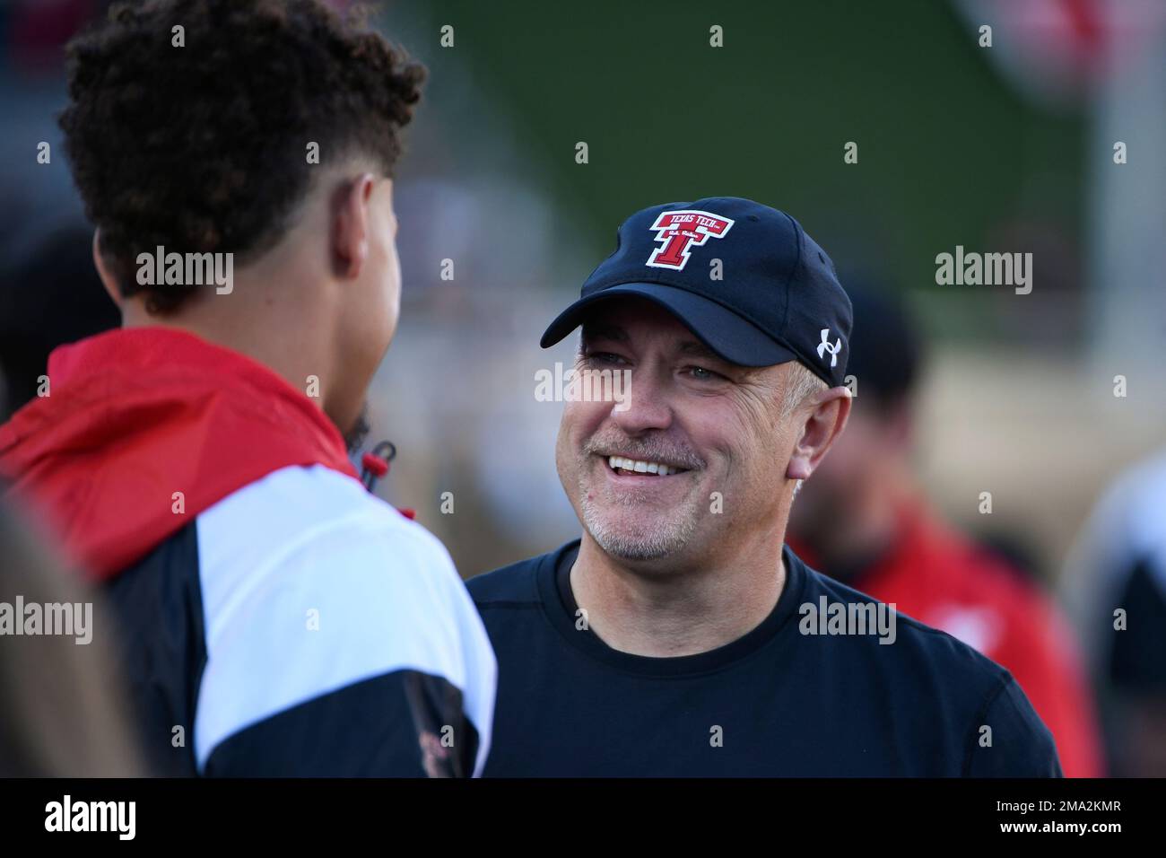 Texas Tech head coach Joey McGuire talks with former quarterback ...