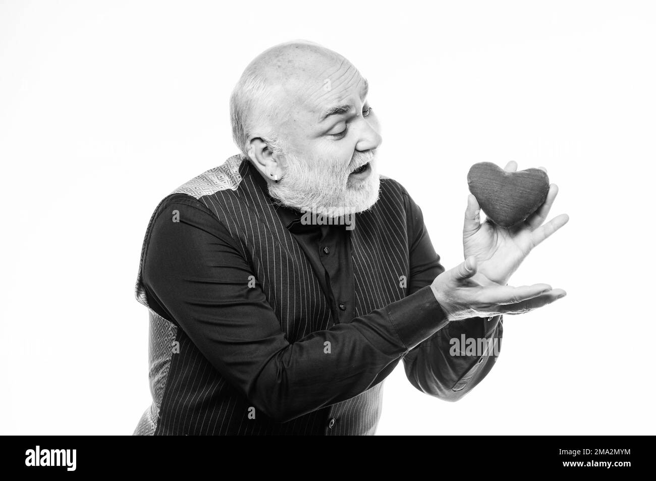 Health care. Senior bald head bearded man hold red heart. Preventing ...