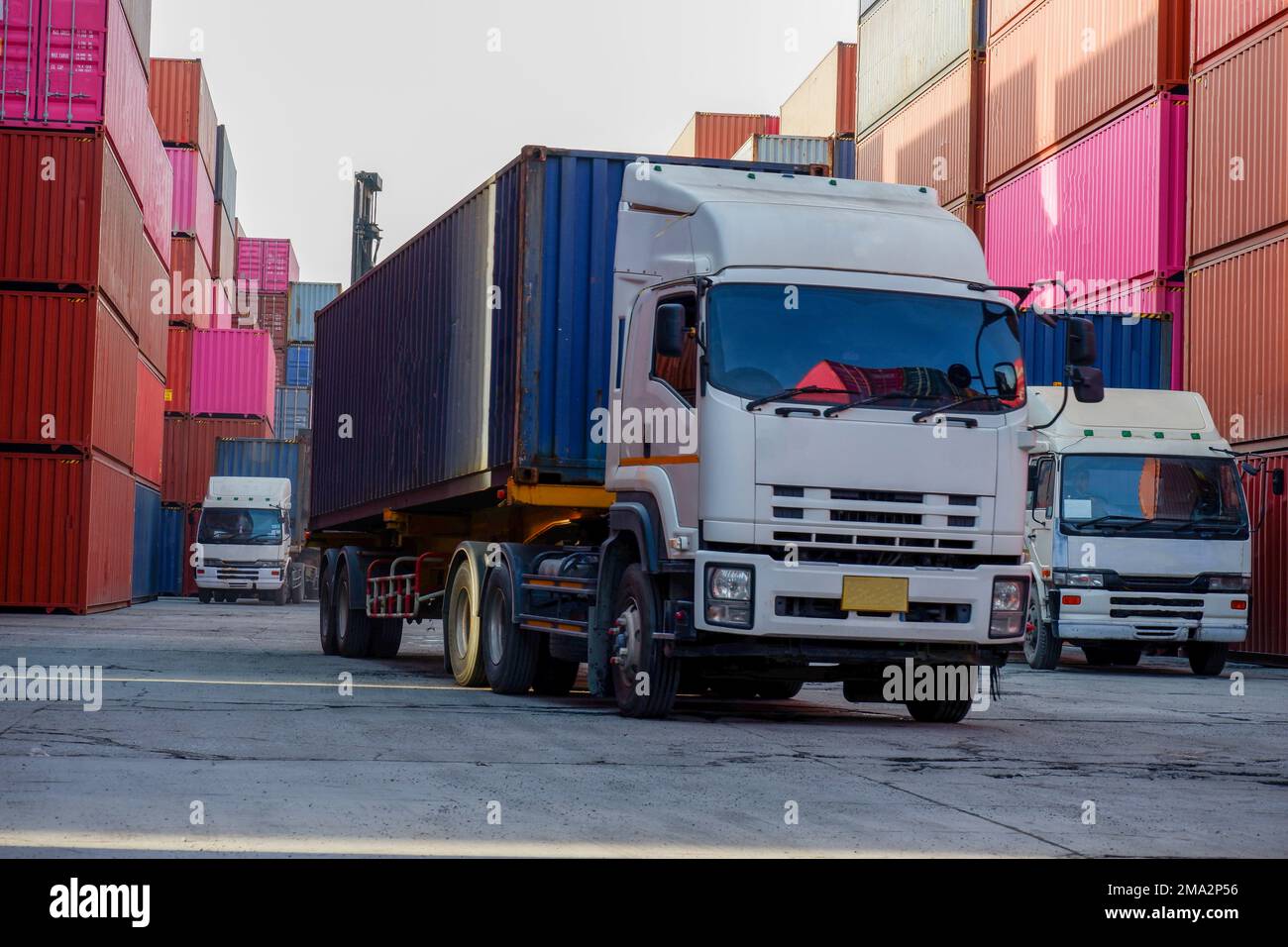 Trucks in the container depot Focus on imports and exports Stock Photo ...