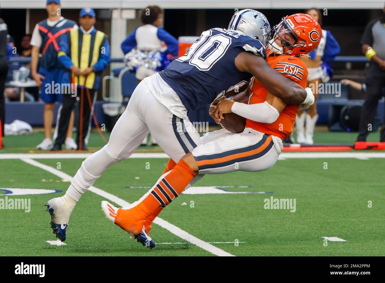 Dallas Cowboys' DeMarcus Lawrence sacks Chicago Bears' Justin Fields on a two-point coversion ...