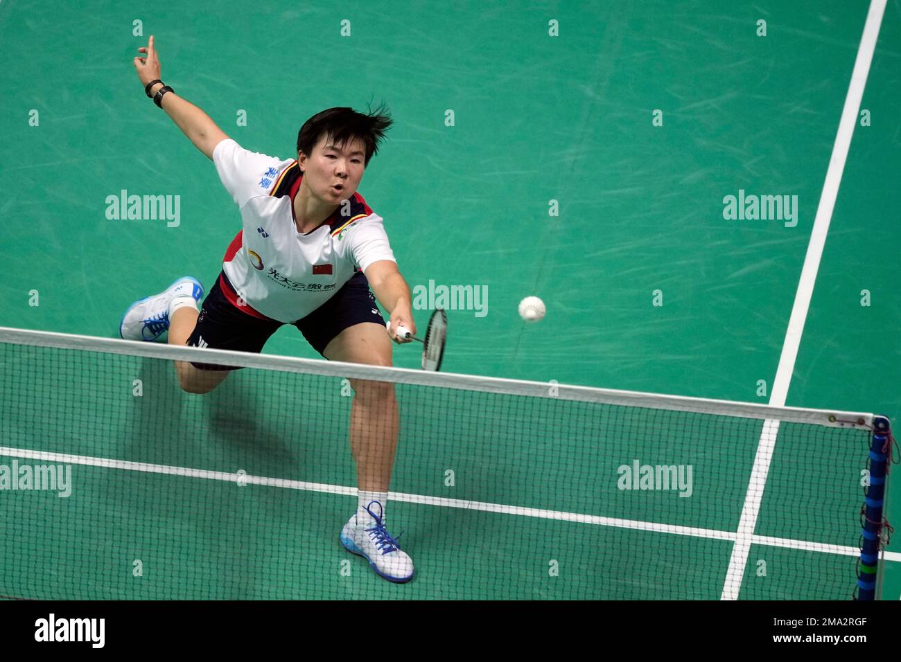 He Bing Jiao of China competes against Carolina Marin of Spain during ...