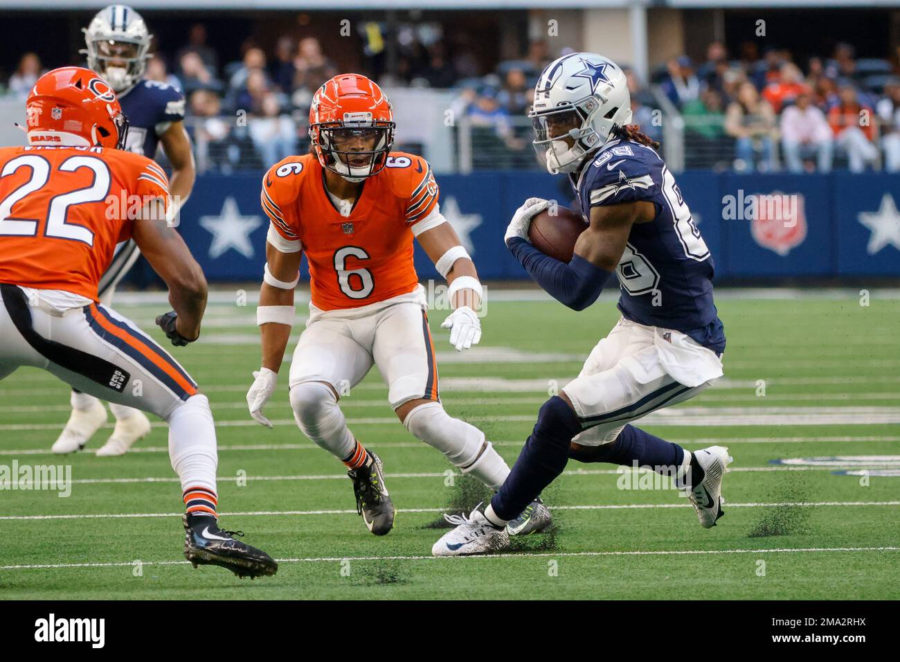 Dallas Cowboys' CeeDee Lamb catches a pass in front of Chicago Bears ...