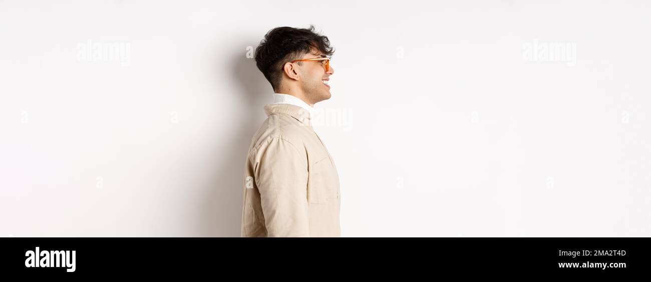 Profile of handsome caucasian man in eyewear, looking at empty space ...