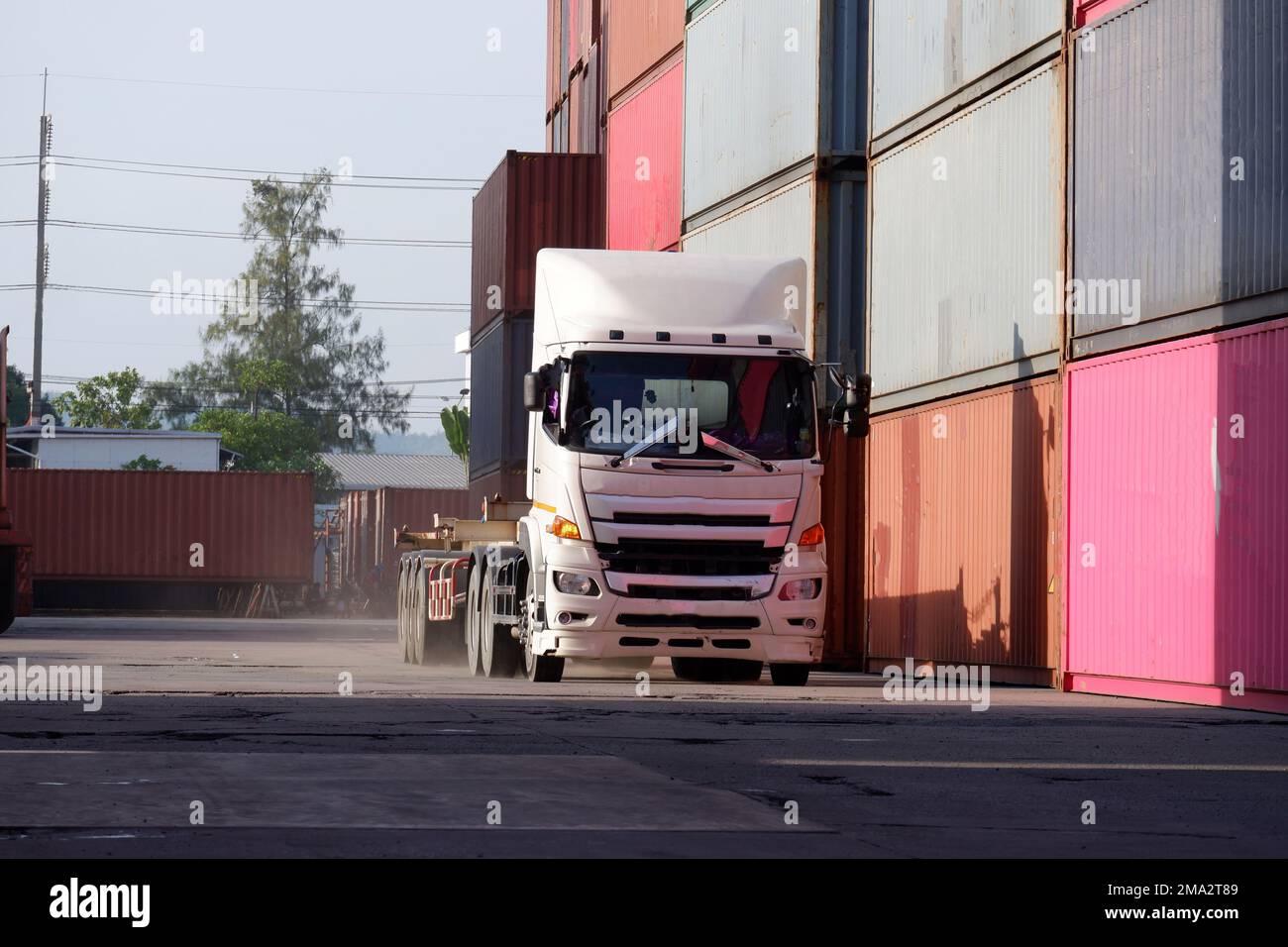 Trucks in the container depot Focus on imports and exports Stock Photo ...