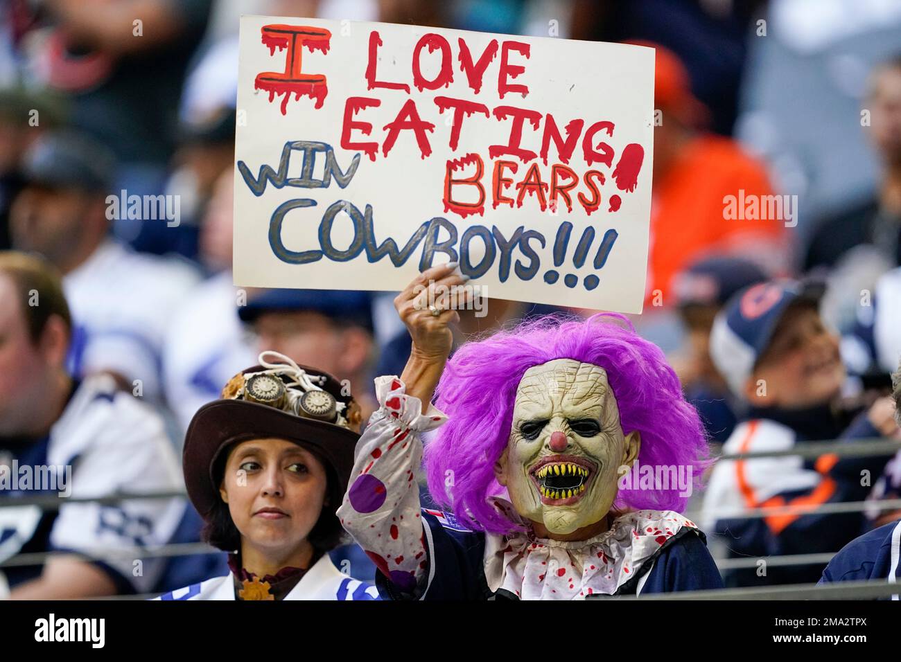 Fans wear costumes before an NFL football game between the Dallas ...