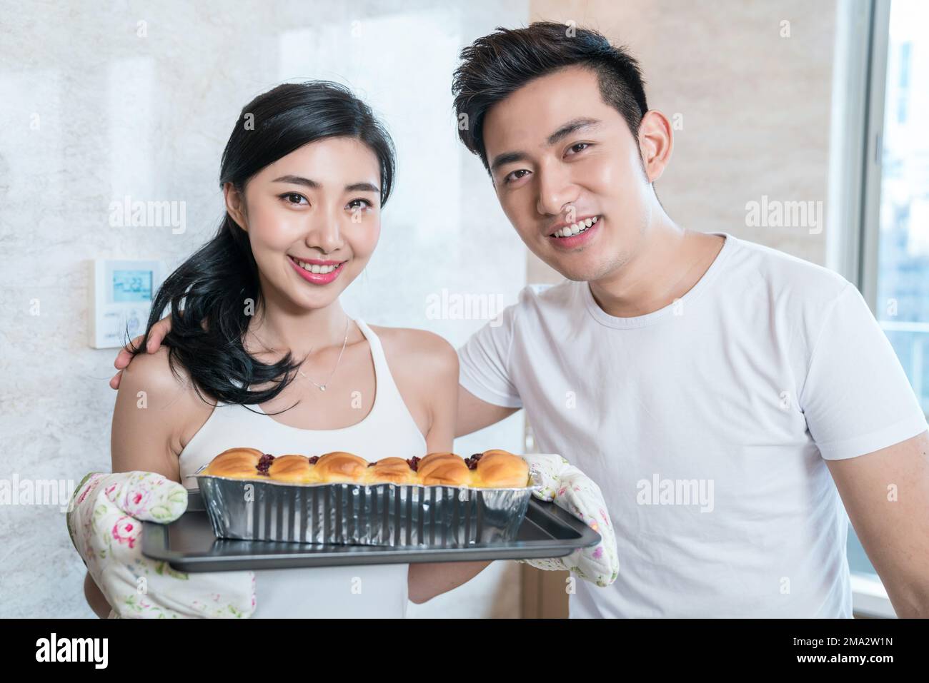 Young lovers baking bread in the kitchen Stock Photo - Alamy