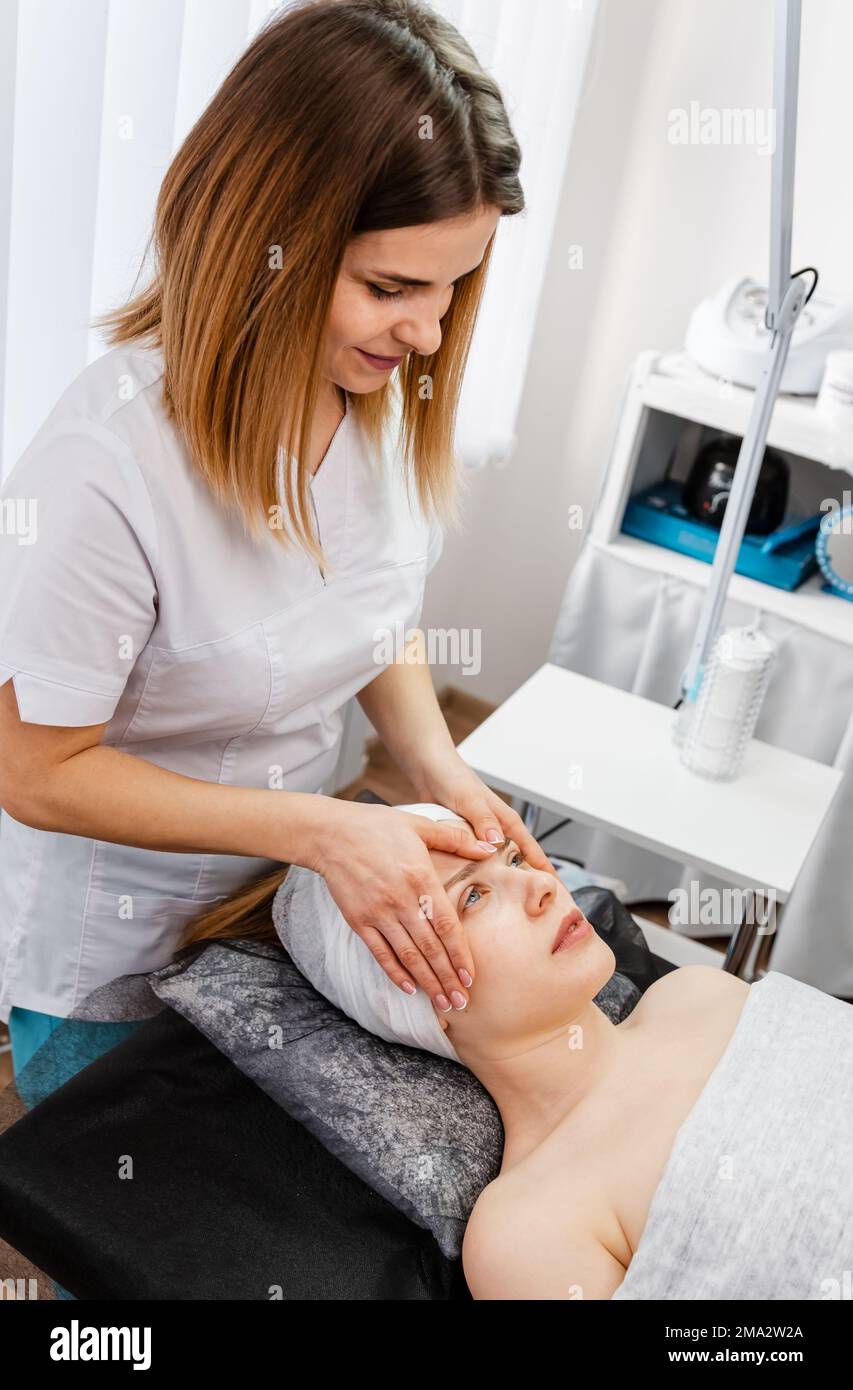 Woman under facial spa procedure hi-res stock photography and images ...