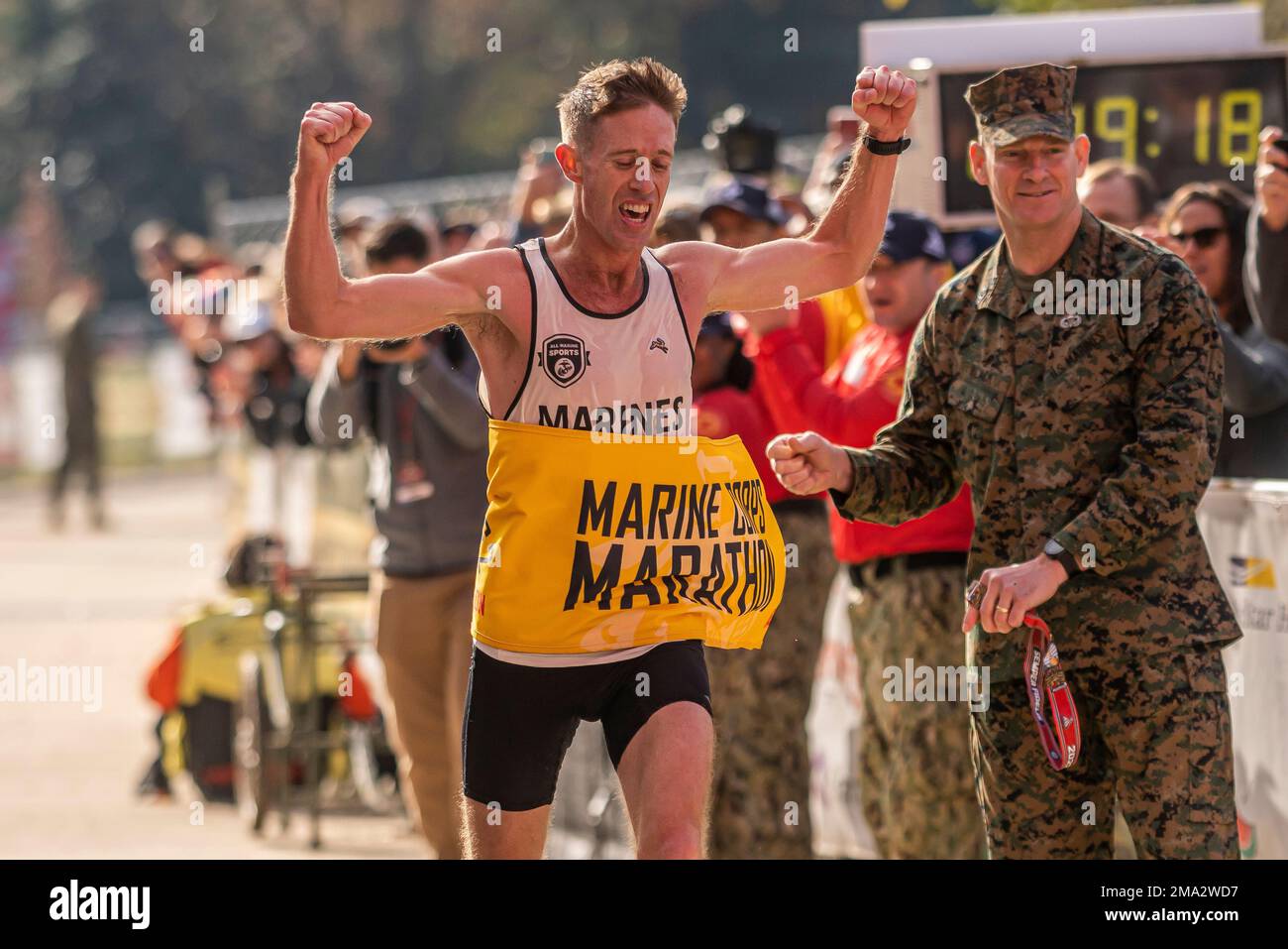 Kyle King crosses the finish line to win the 47th Marine Corps Marathon with a time of 2:19:19 ...