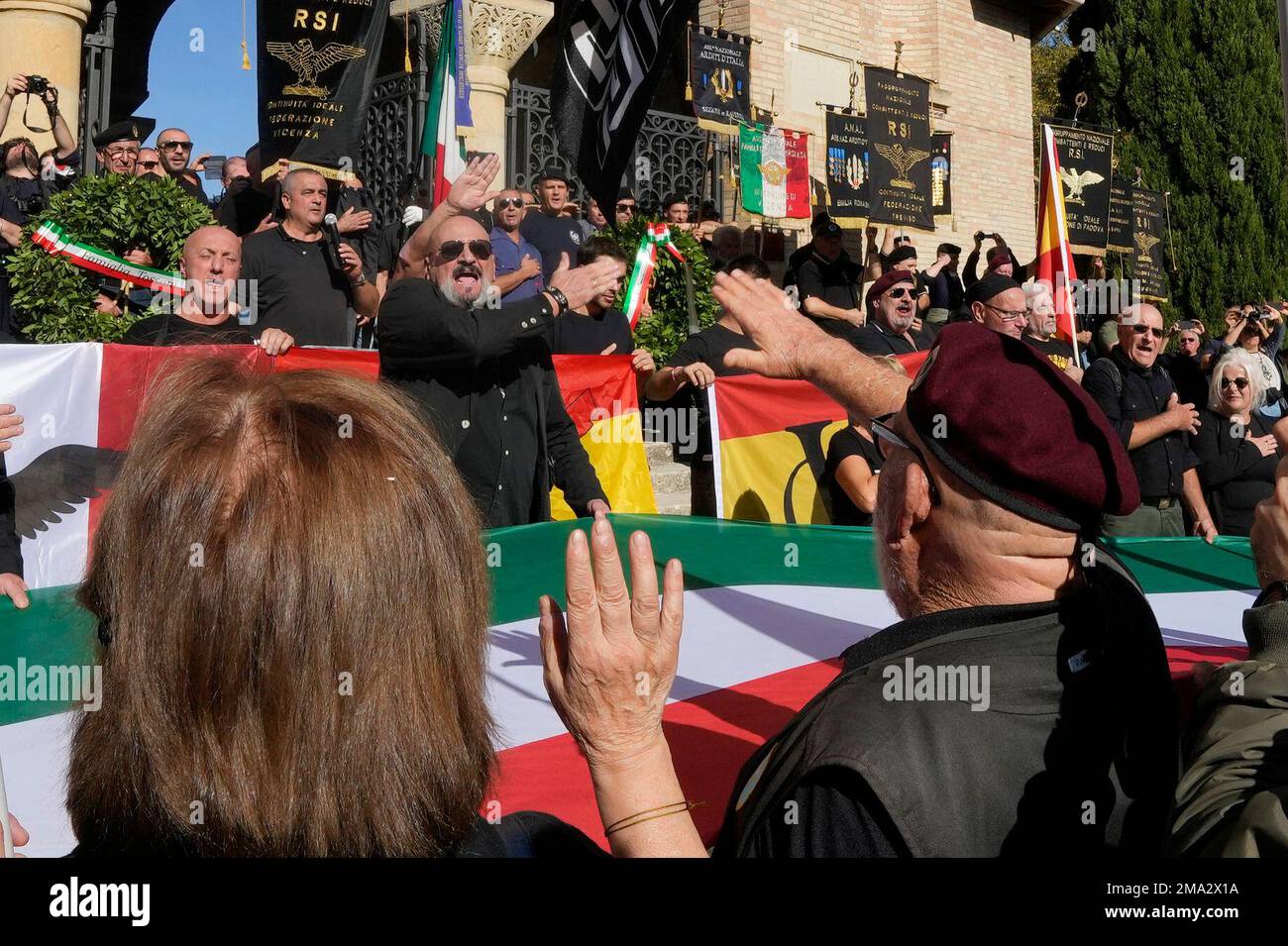 People perform a roman salute in the hometown of former dictator Benito ...