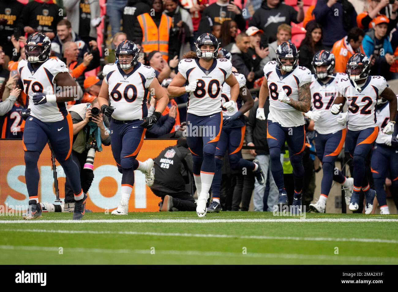 Denver Broncos players enter the pitch before the NFL football game ...